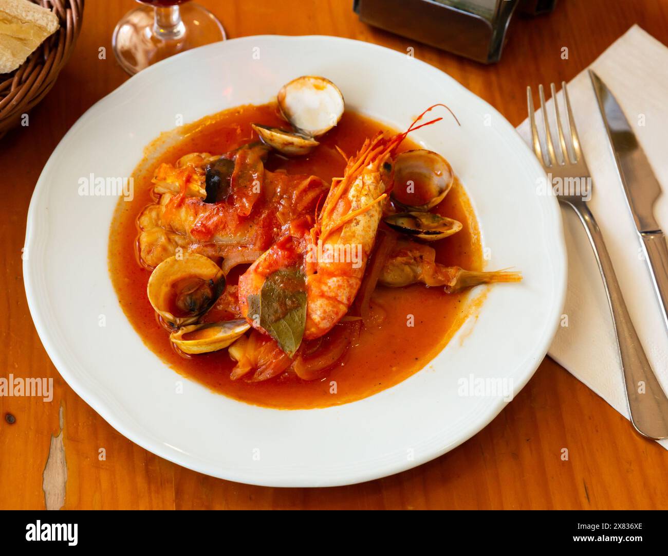 Tail of monkfish with shellfish, prawns Stock Photo - Alamy
