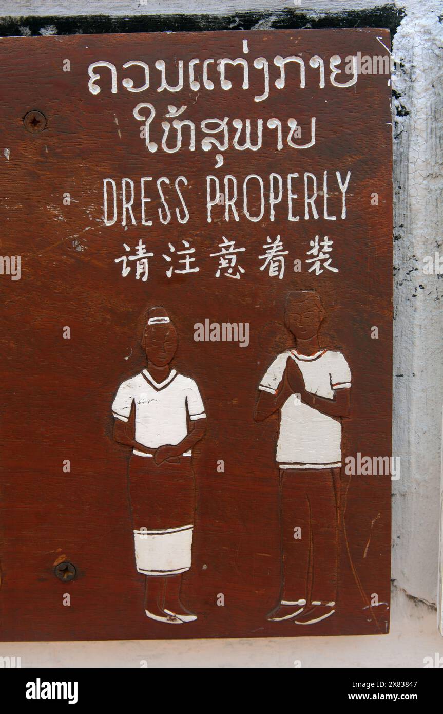 Dress Properly sign for tourists, Wat Chom Si on Phou Si Hill, Luang ...