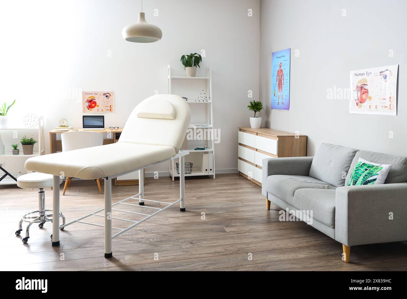 Interior of medical office with couch, sofa and doctor's workplace ...