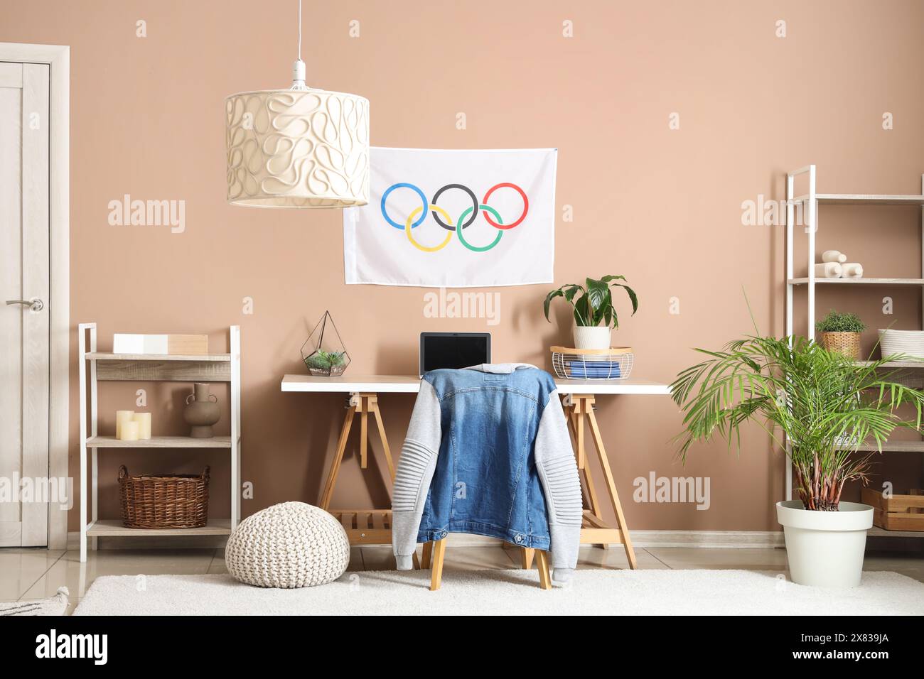 Interior of room with workplace, shelf units and Olympic flag Stock ...