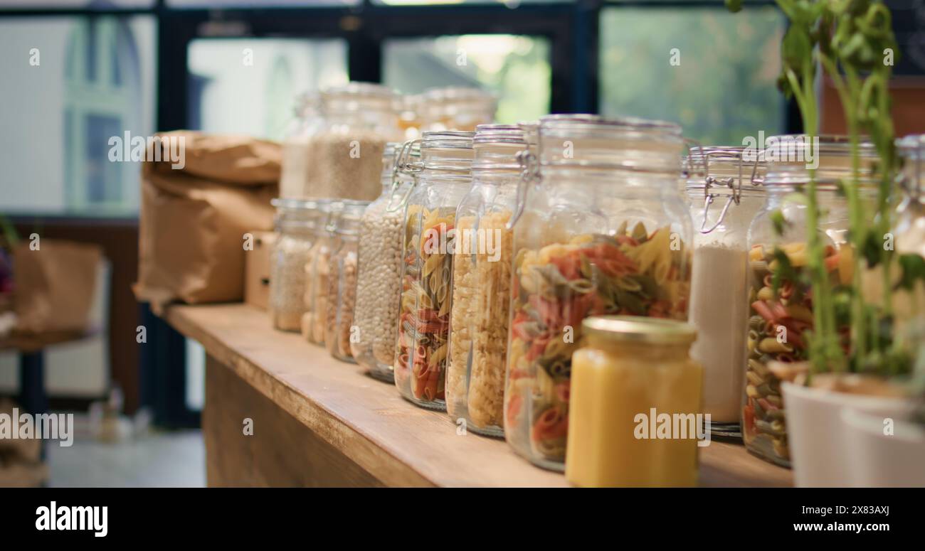 Close up on bulk products in reusable jars used by zero waste eco store ...