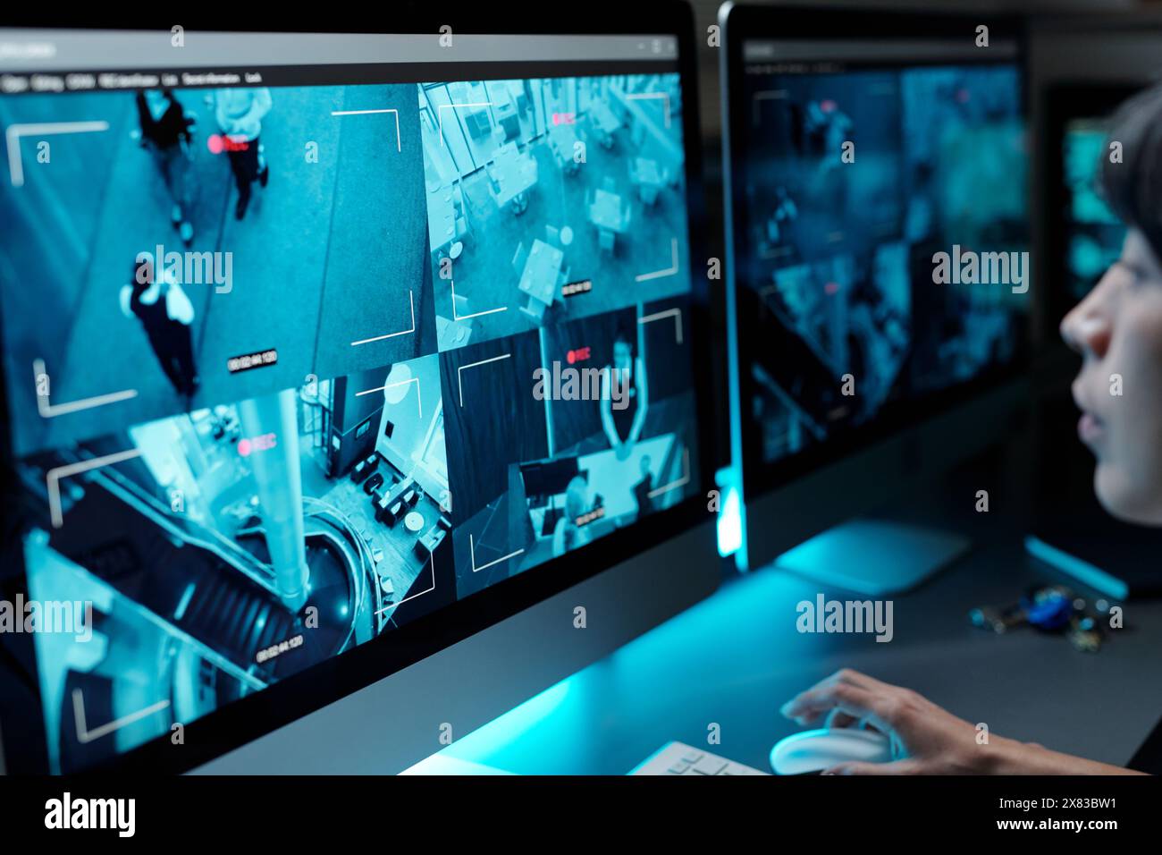 Computer monitors with cctv video on screens standing on workplace of ...