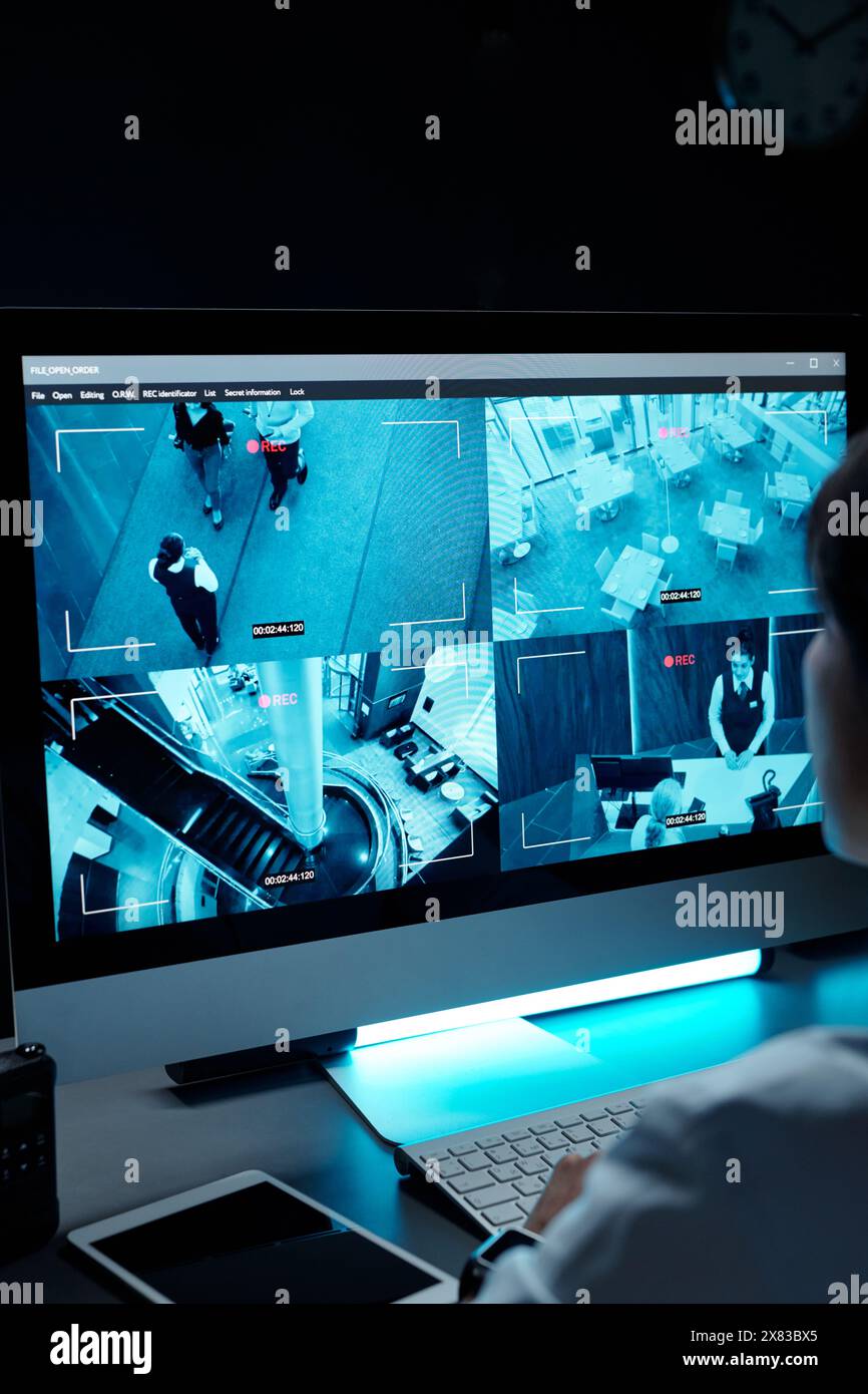 Screen of computer with cctv video system standing on workplace of ...