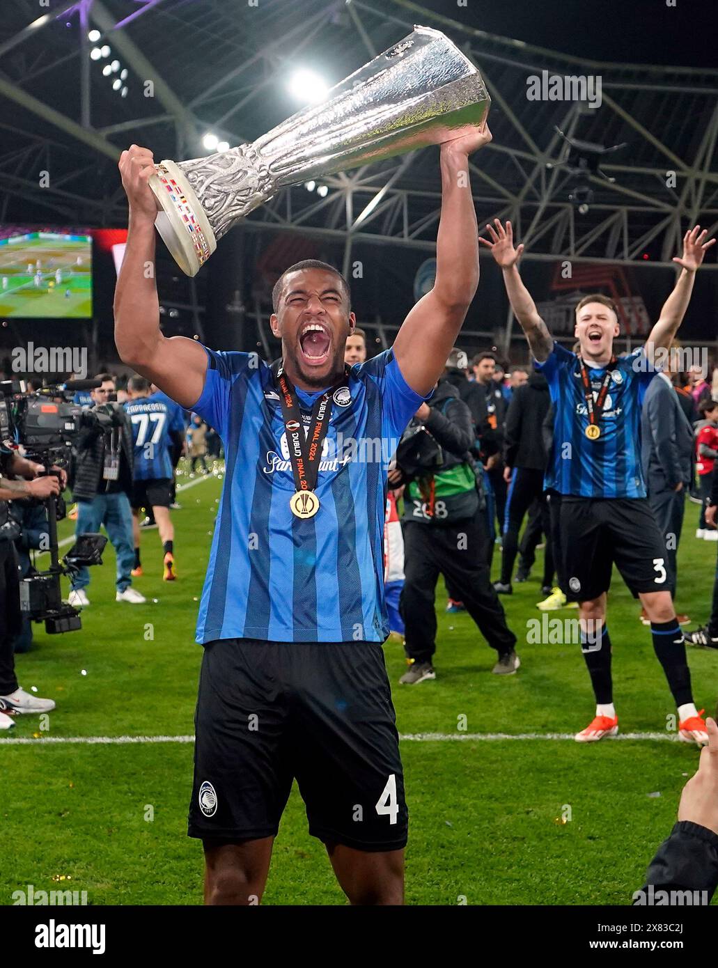Atalanta's Isak Hien celebrates with the trophy after the UEFA Europa ...