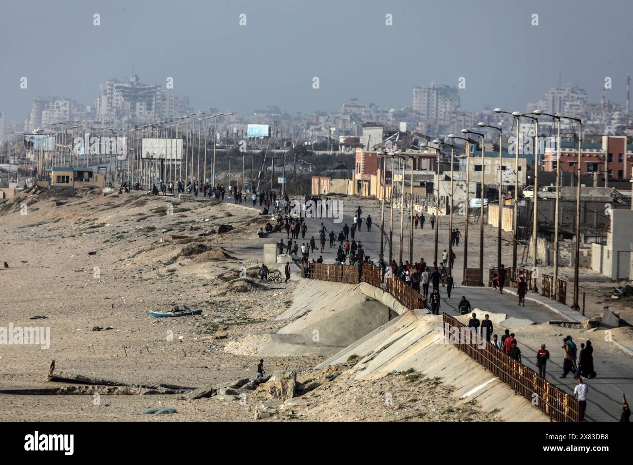 Gaza City, Palestinian Territories. 22nd May, 2024. Palestinians walk ...