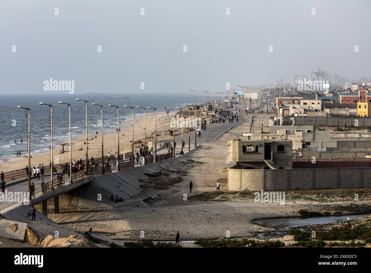 Gaza City, Palestinian Territories. 22nd May, 2024. Palestinians walk ...