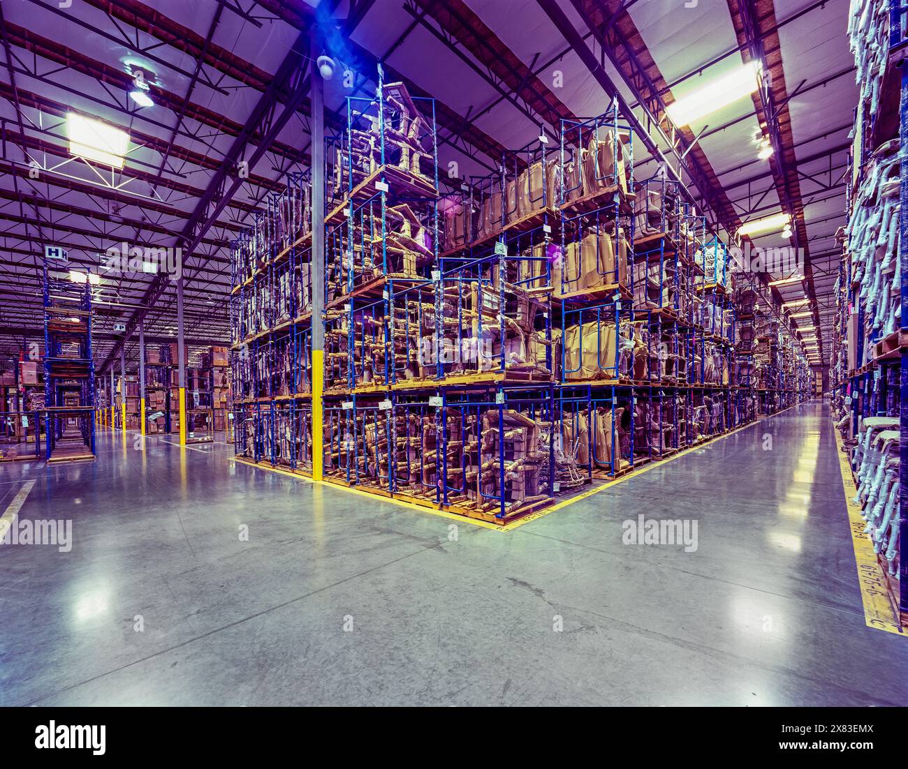 A stocked warehouse with shelving and boxes Stock Photo - Alamy