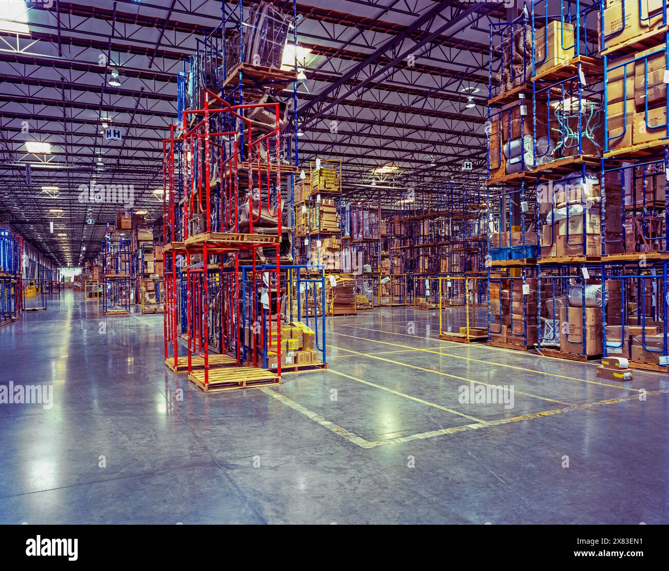 A stocked warehouse with shelving and boxes Stock Photo - Alamy