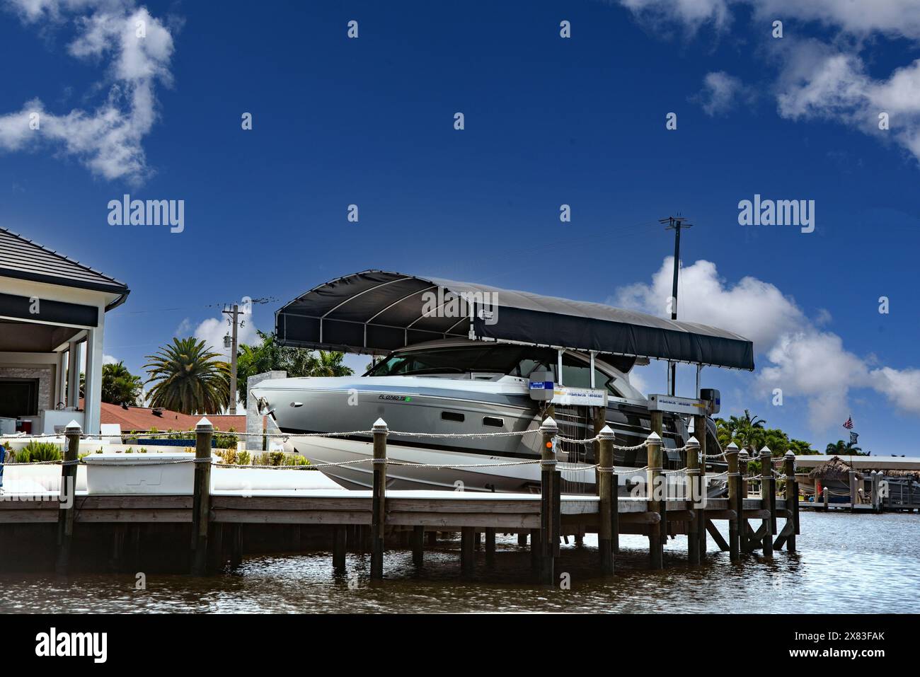 Boat lift and dock, Bimini Basin, Cape Coral, Florida, USA Stock Photo ...