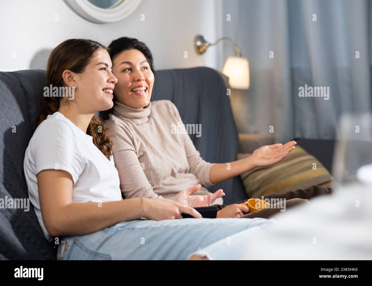 Female friends watching film hi-res stock photography and images - Alamy