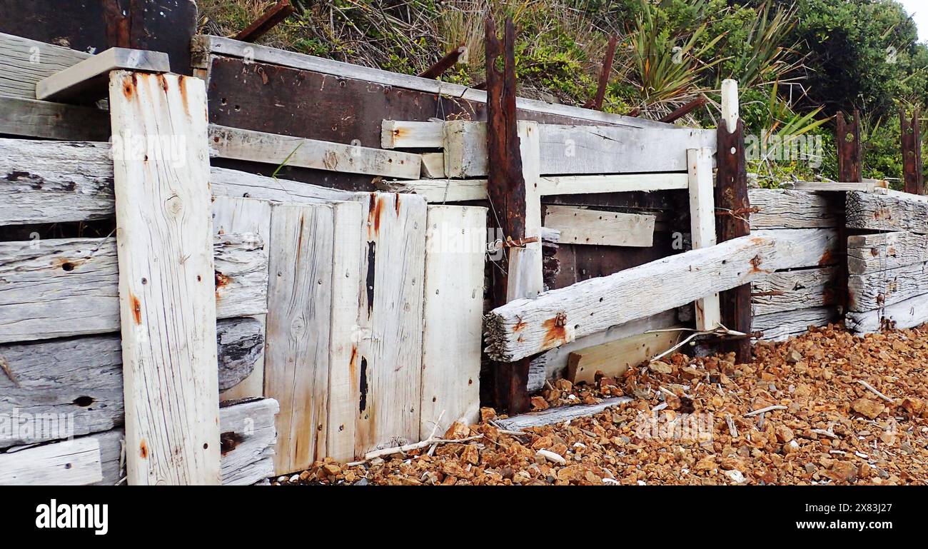 A mix of timber boards forms a broken and optimistic sea wall just ...