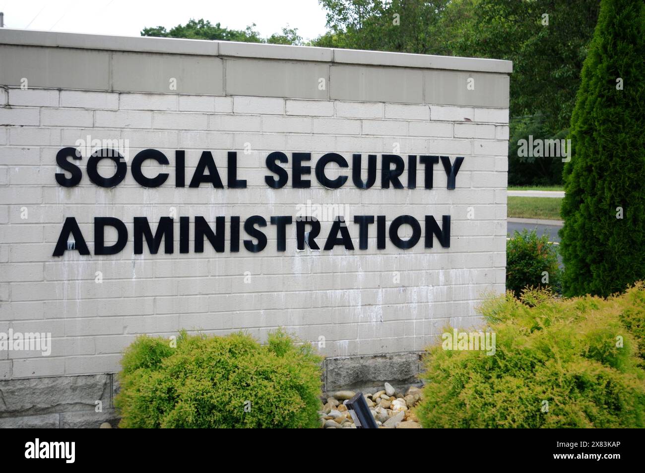 Dirty and weather worn white brick wall with Social Security ...
