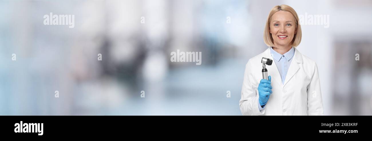 Professional dermatologist with dermatoscope on blurred background ...