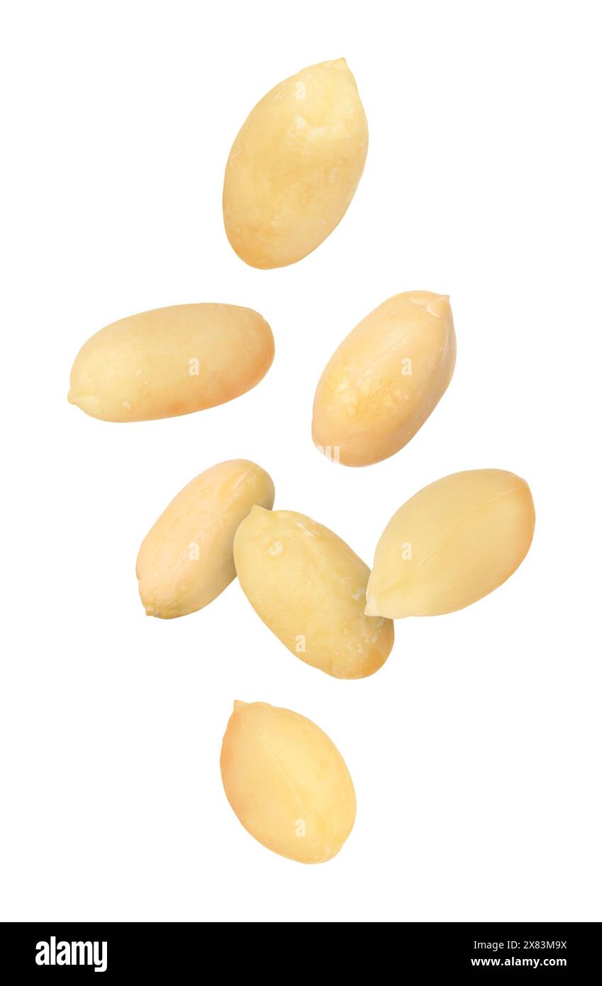 Many peanuts in air on white background Stock Photo - Alamy