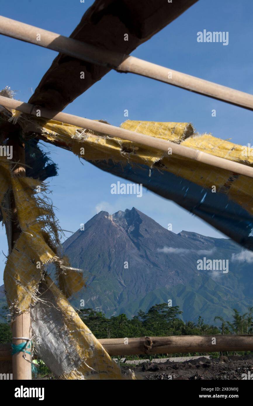Mount Merapi, a cone-shaped and most active type of volcano in ...