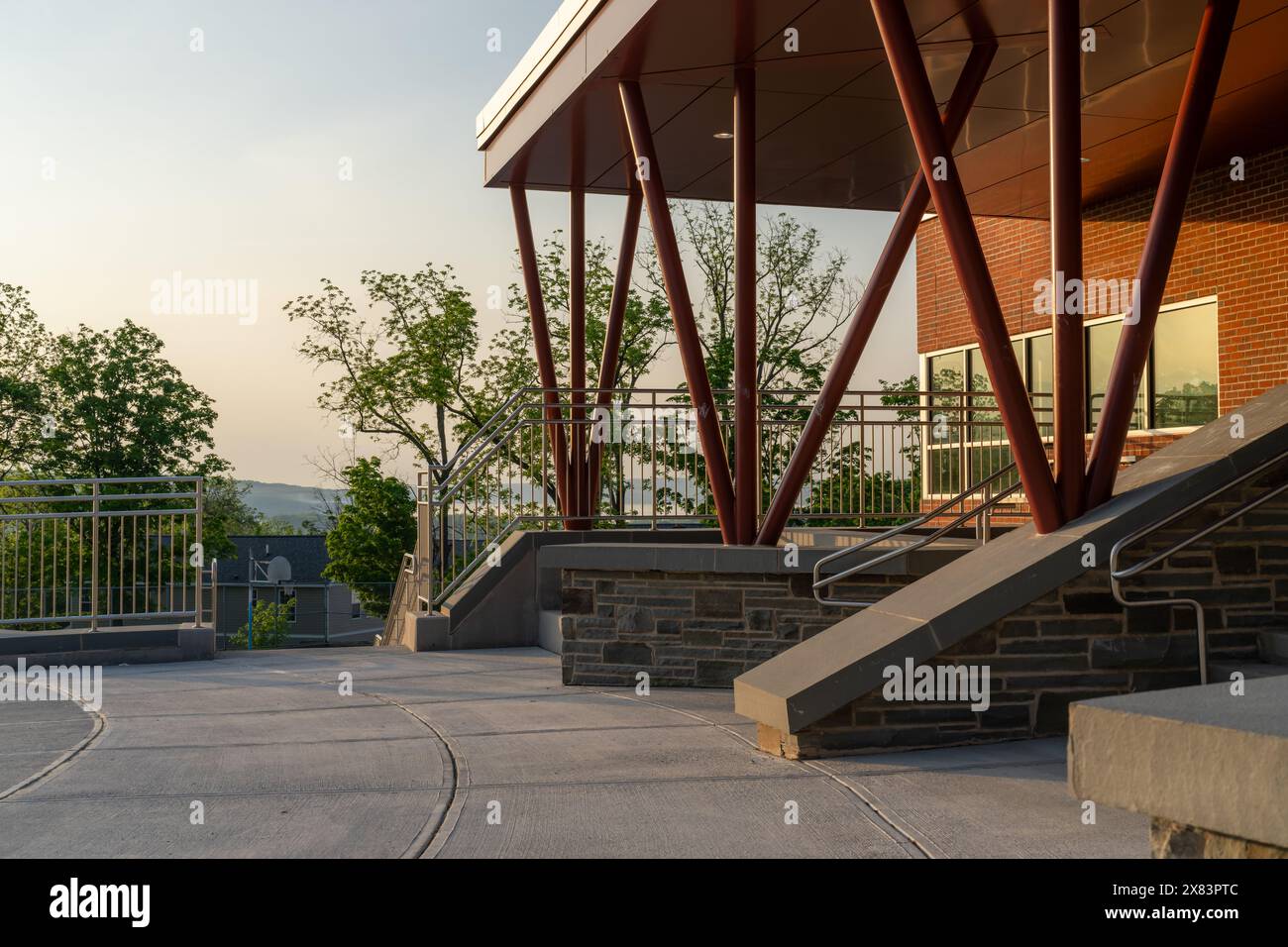Example of a stainless steel railing along an exterior set of stairs at ...