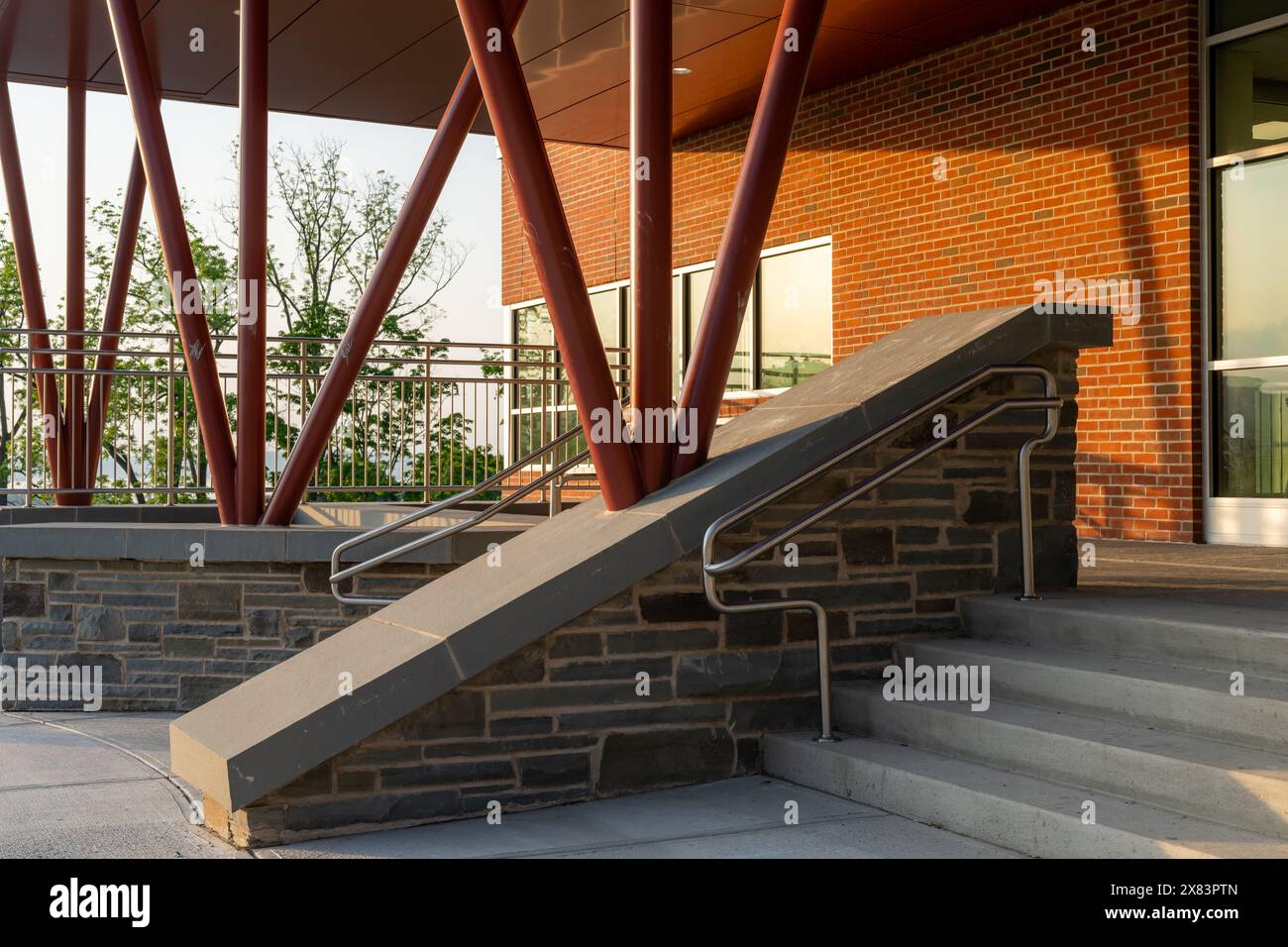 Example of a stainless steel railing along an exterior set of stairs at ...