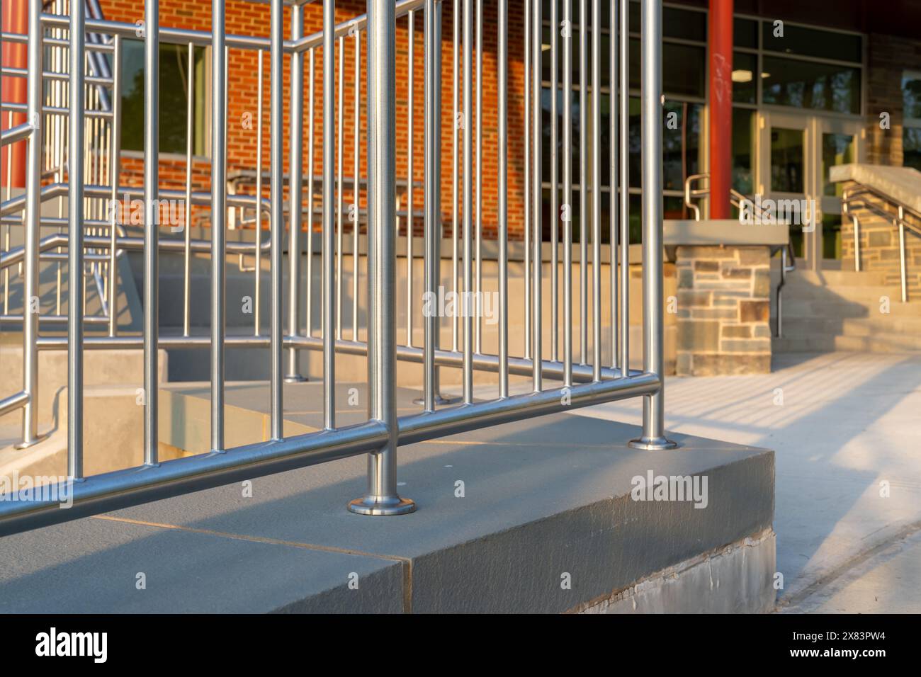 Example of a stainless steel railing along an exterior set of stairs at ...