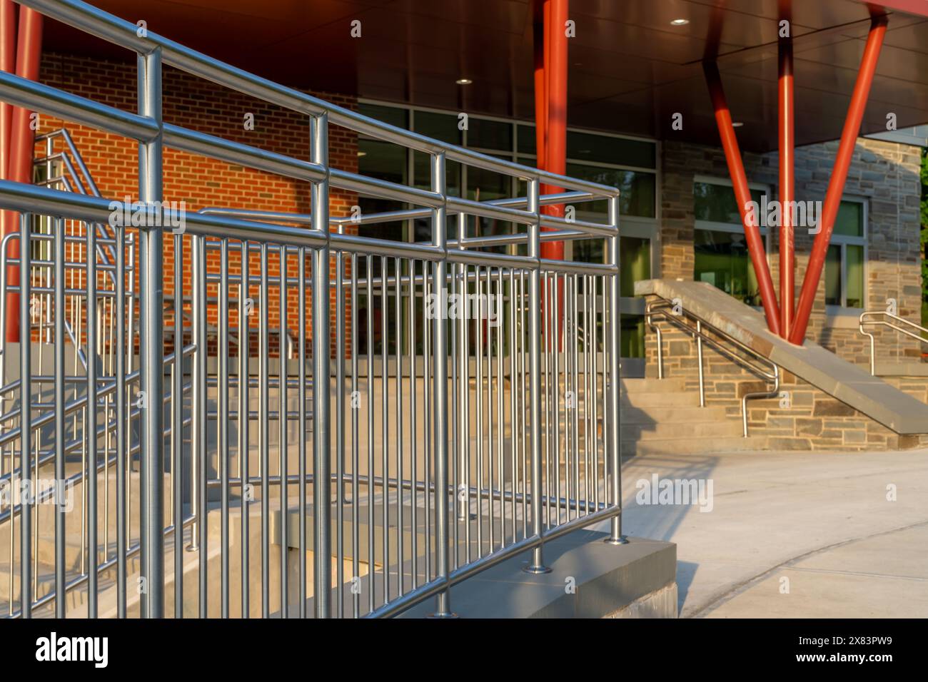 Example of a stainless steel railing along an exterior set of stairs at ...