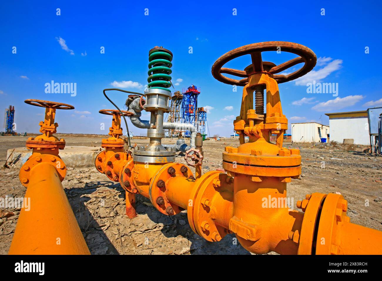 Oil pipes and valves Stock Photo - Alamy