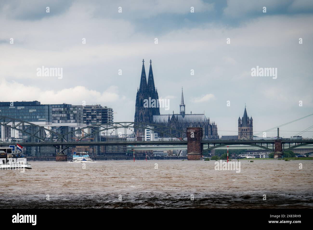 cologne, germany may 22 2024: cargo ships pass through cologne on the ...