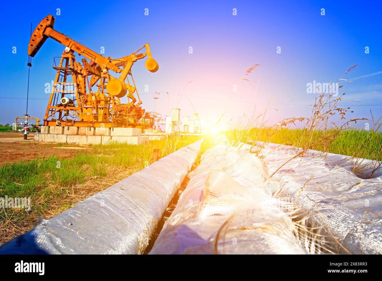 Oil pipes and valves Stock Photo - Alamy