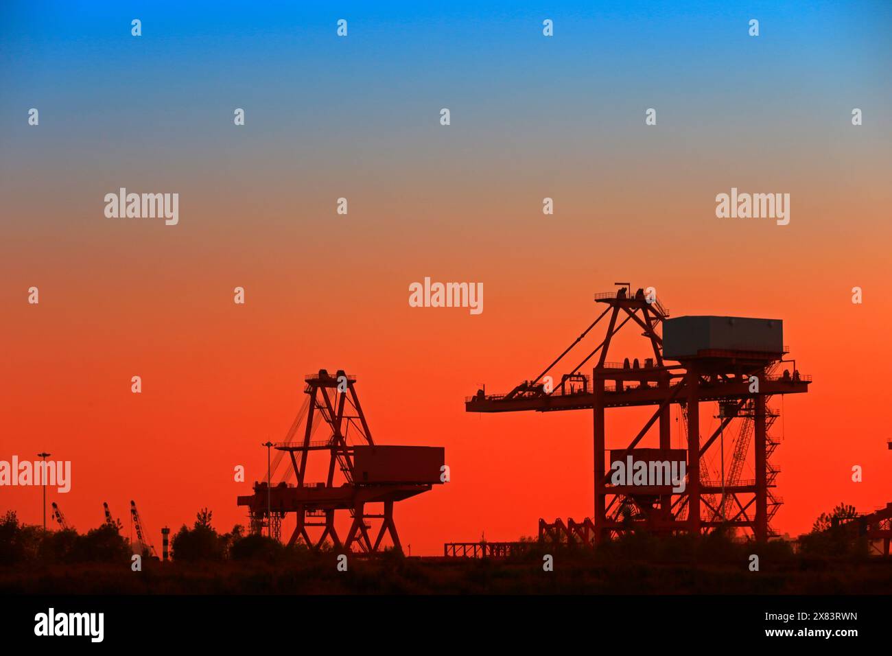 Port crane unloading container ships Stock Photo - Alamy