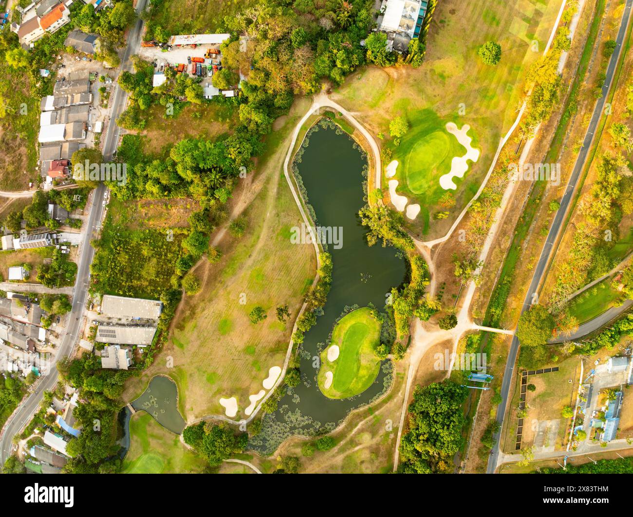Aerial view drone shot of beautiful green golf field at Phuket island ...