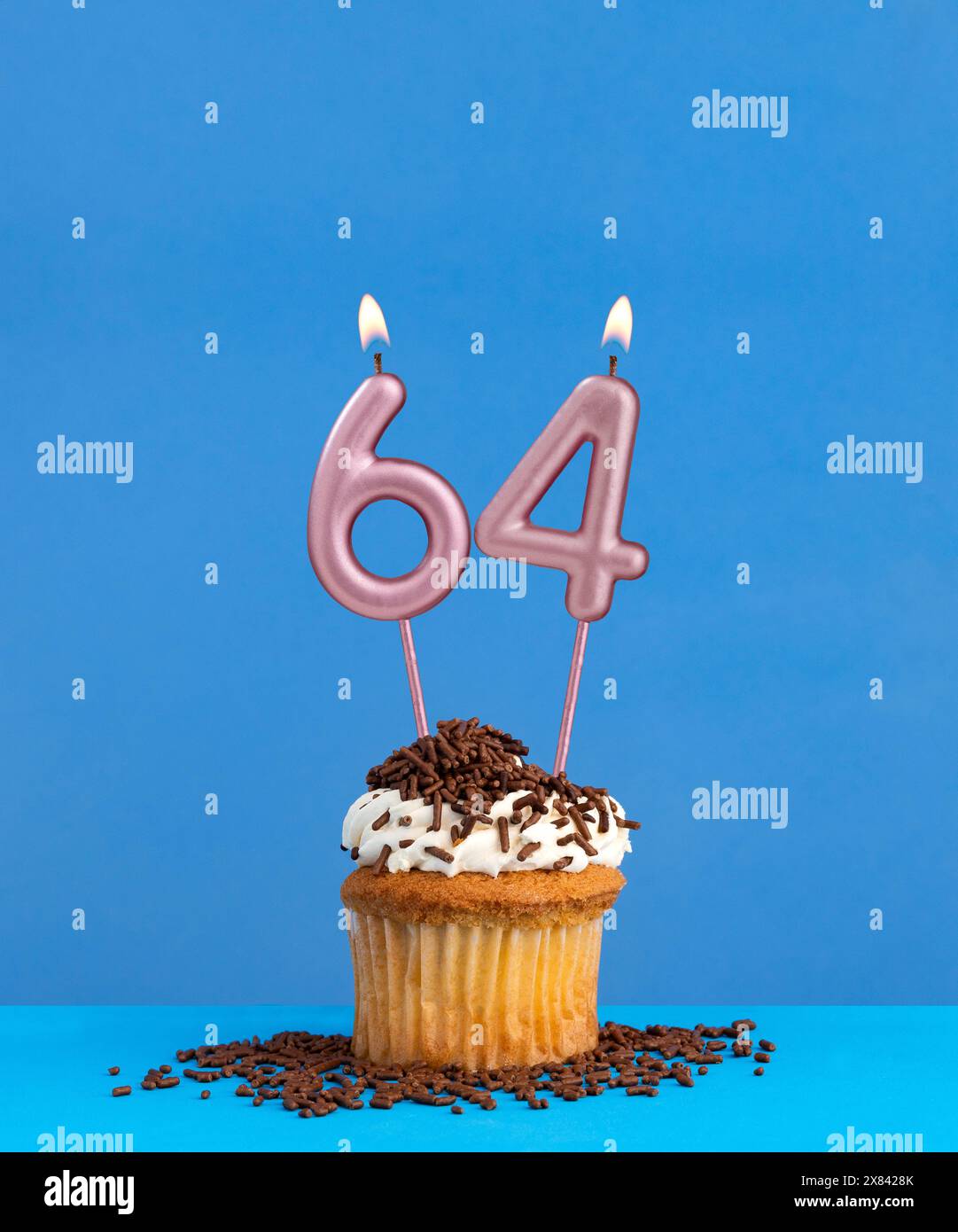 Candle number 64 - Birthday card with cupcake on blue background Stock ...