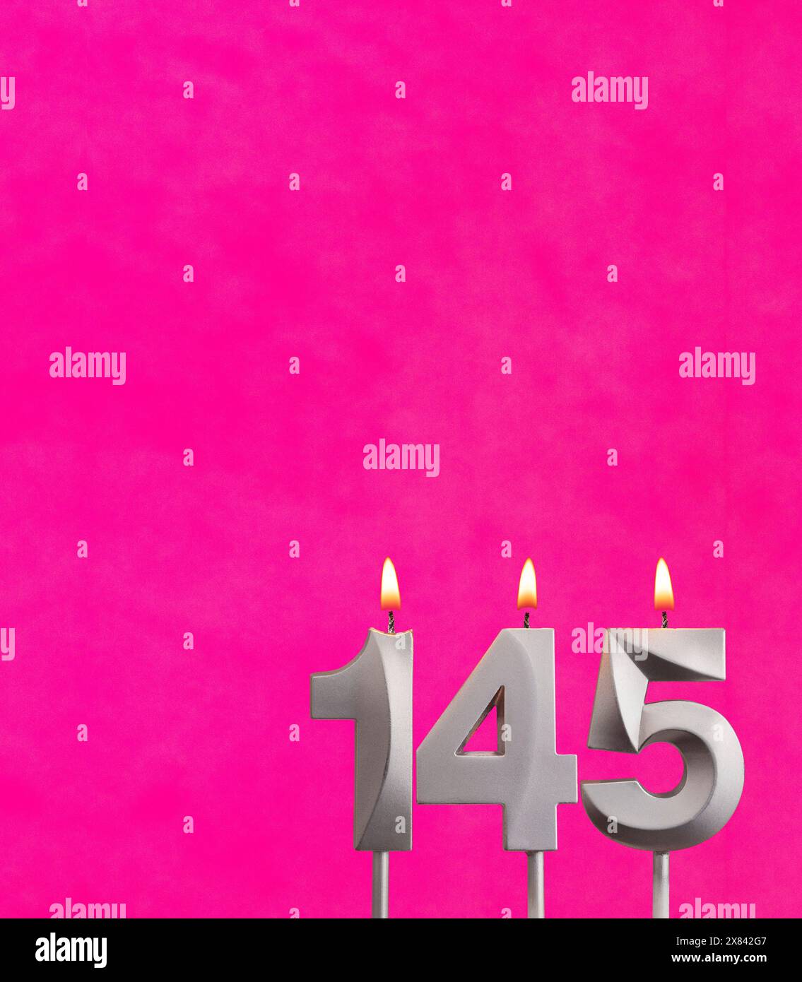 Candle number 145 - Birthday celebration on fuchsia background Stock ...
