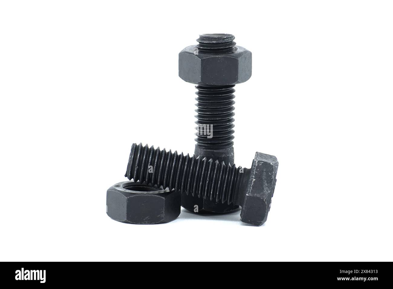 Black metal hexagonal bolts and nuts shown in close-up isolated on ...