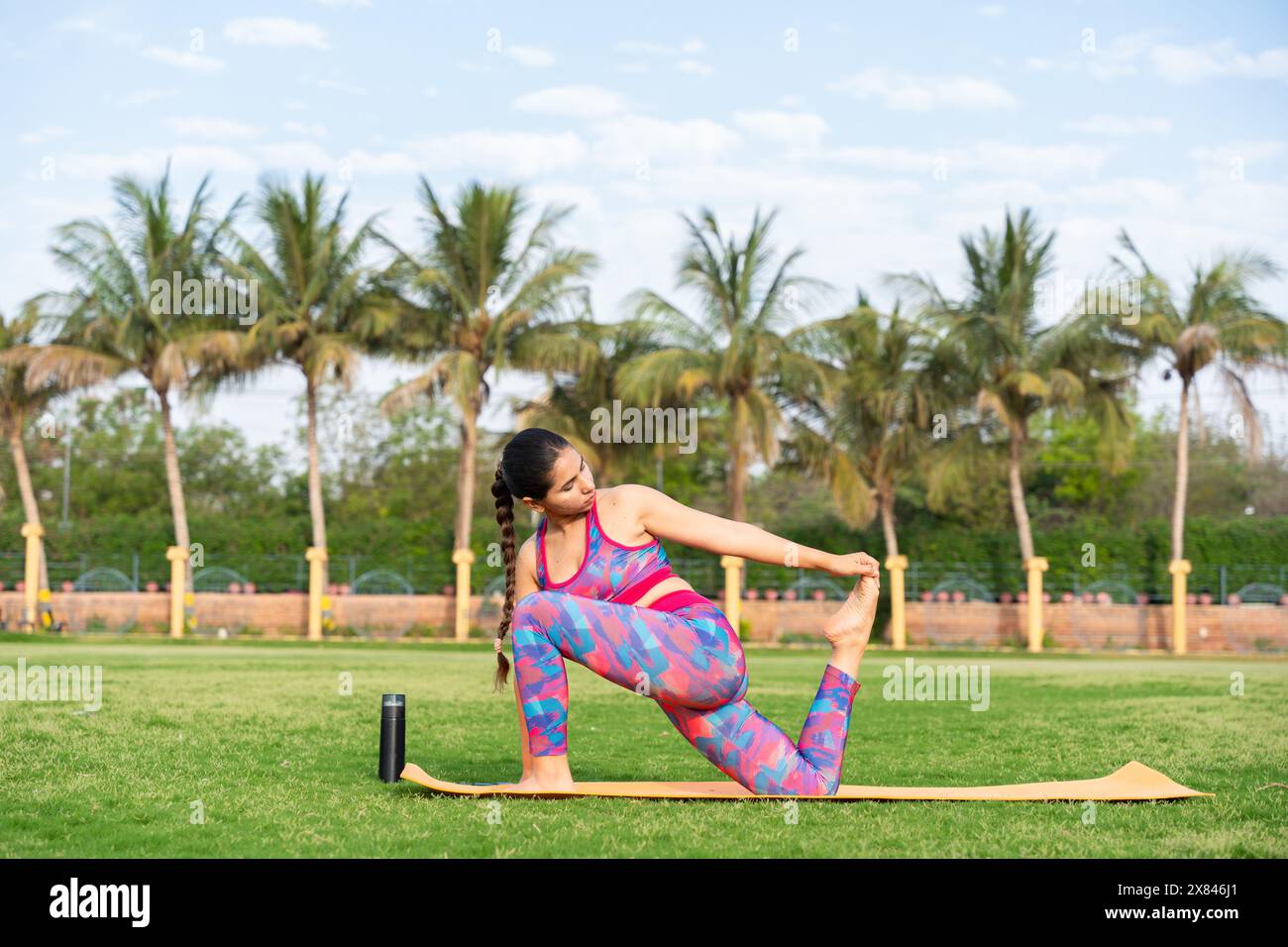 Fit Young indian girl doing One Legged King Pigeon Yoga Pose in her ...