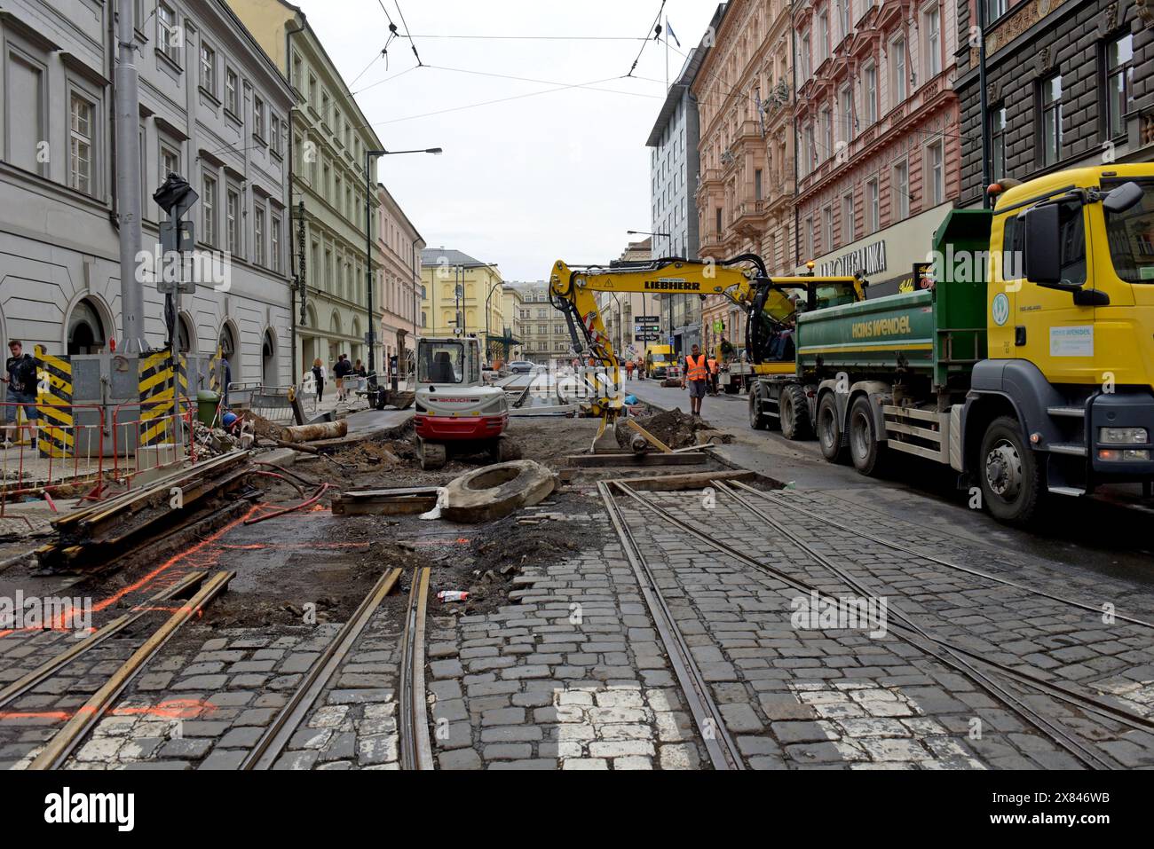 Construction workers relaying tram railway tracks in the street at Senovážné náměstí, Prague ...
