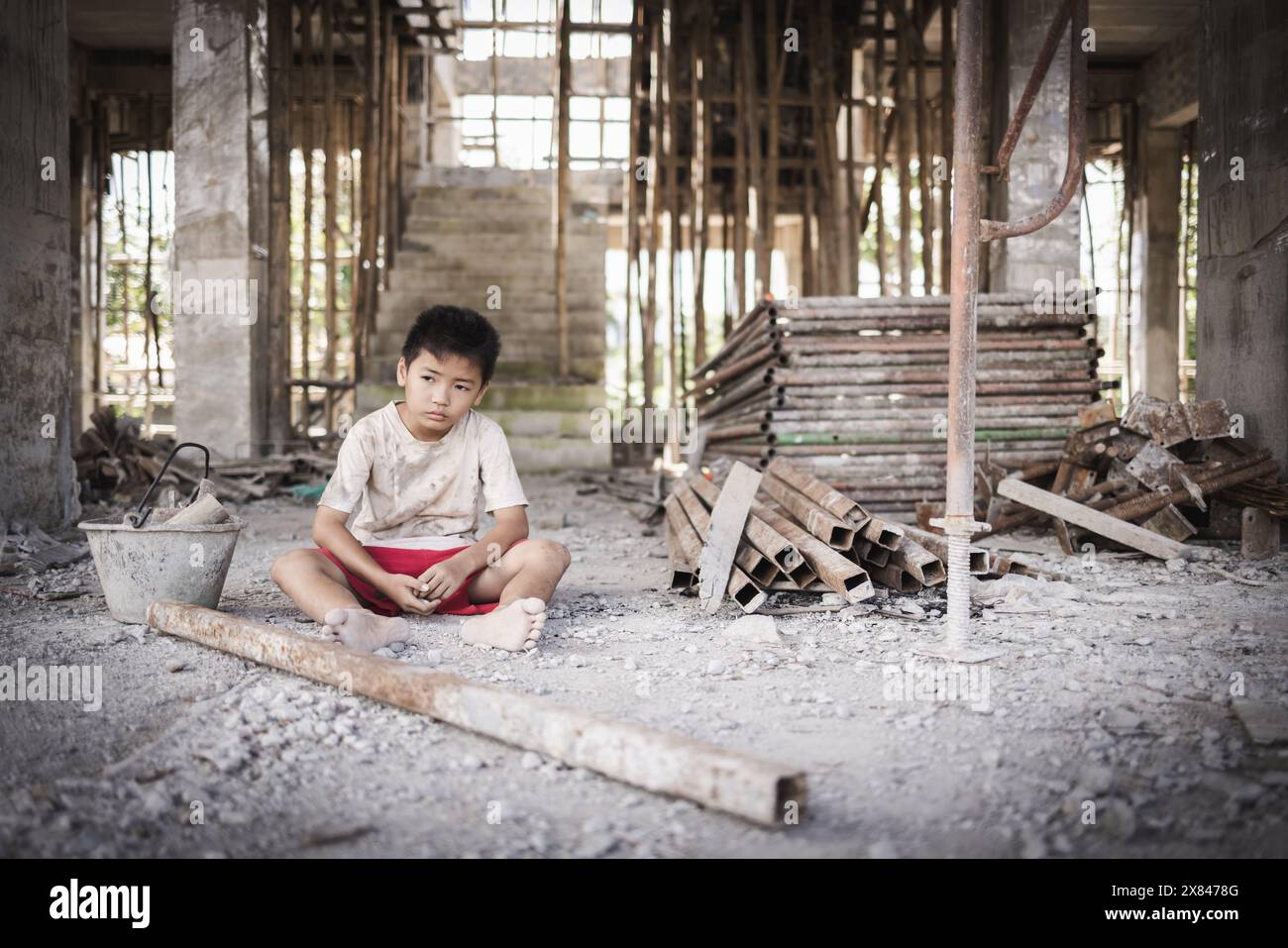 Two poor children are forced to work in construction. Poor children ...
