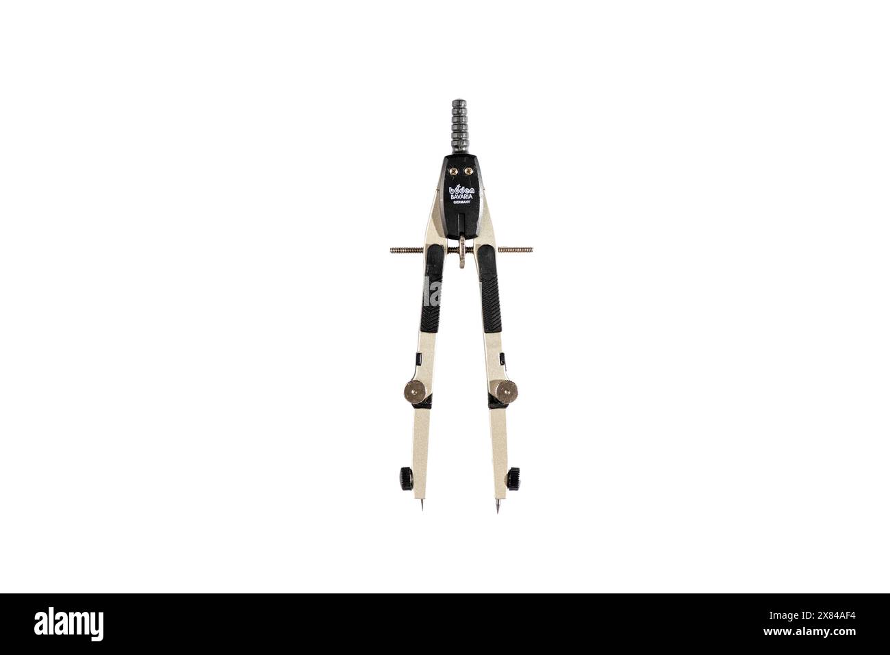 Metal precision compass for geometric drawings on a white background ...