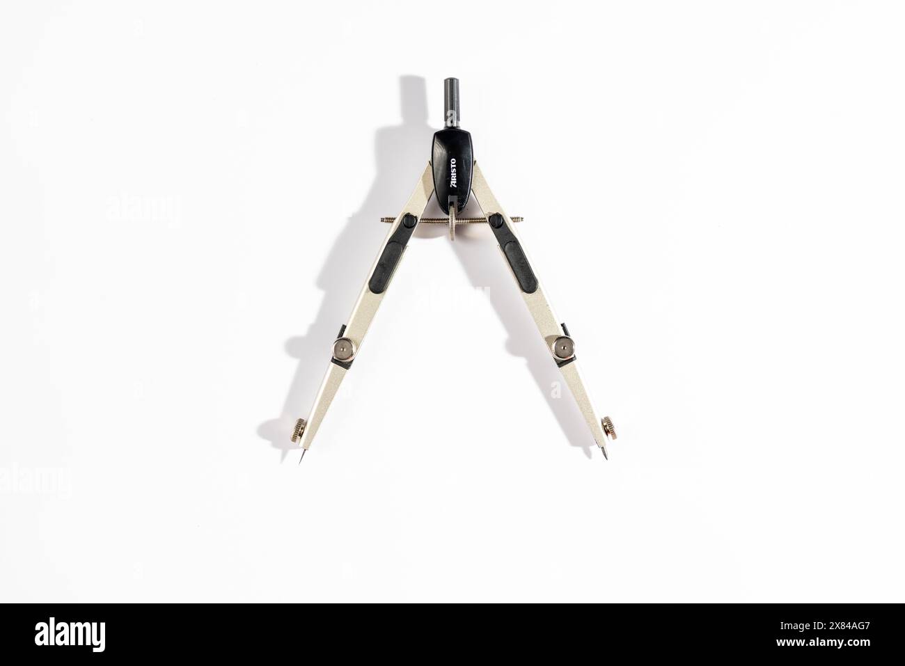 Metal compasses for precise drawings, white background Stock Photo - Alamy