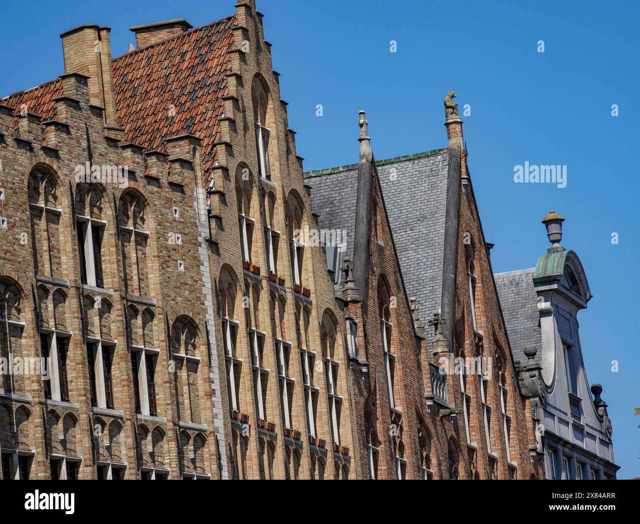 Close-ups of historic buildings with gothic features and tiled roofs ...
