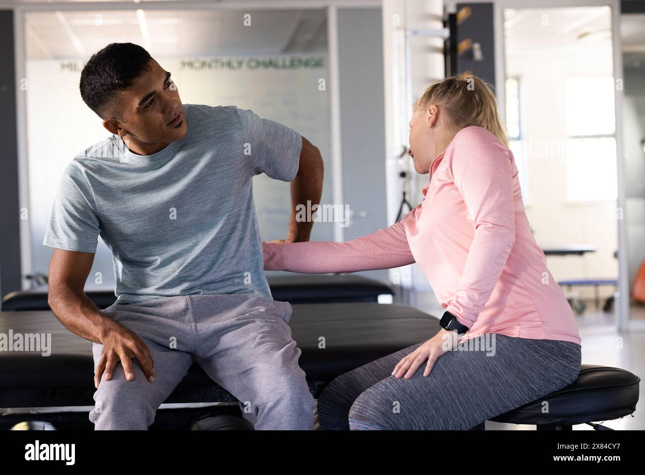 At rehabilitation center, Caucasian female physical therapist helping ...