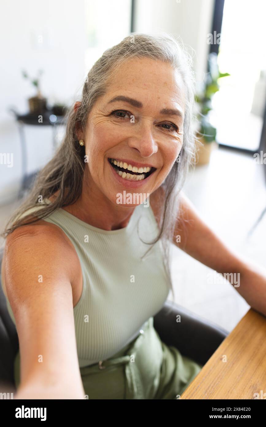 Woman smiling during video call hi-res stock photography and images - Alamy