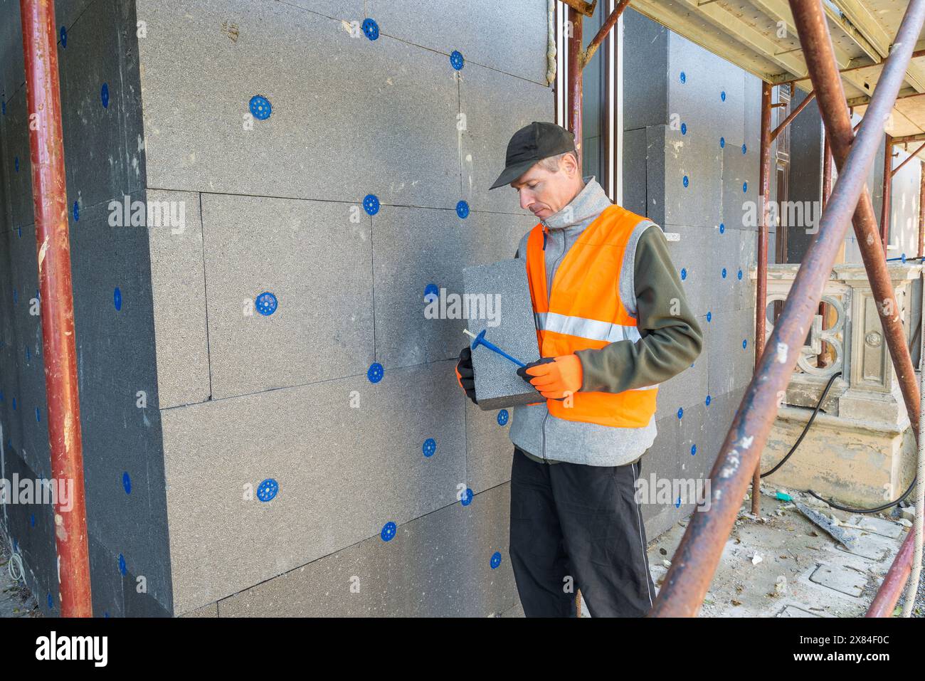 Installation of thermal insulation on the facade of a house. Thermal ...