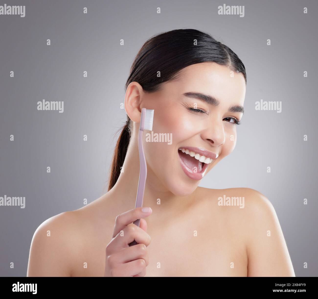 Portrait, woman and brushing teeth with wink, dental hygiene and cavity ...