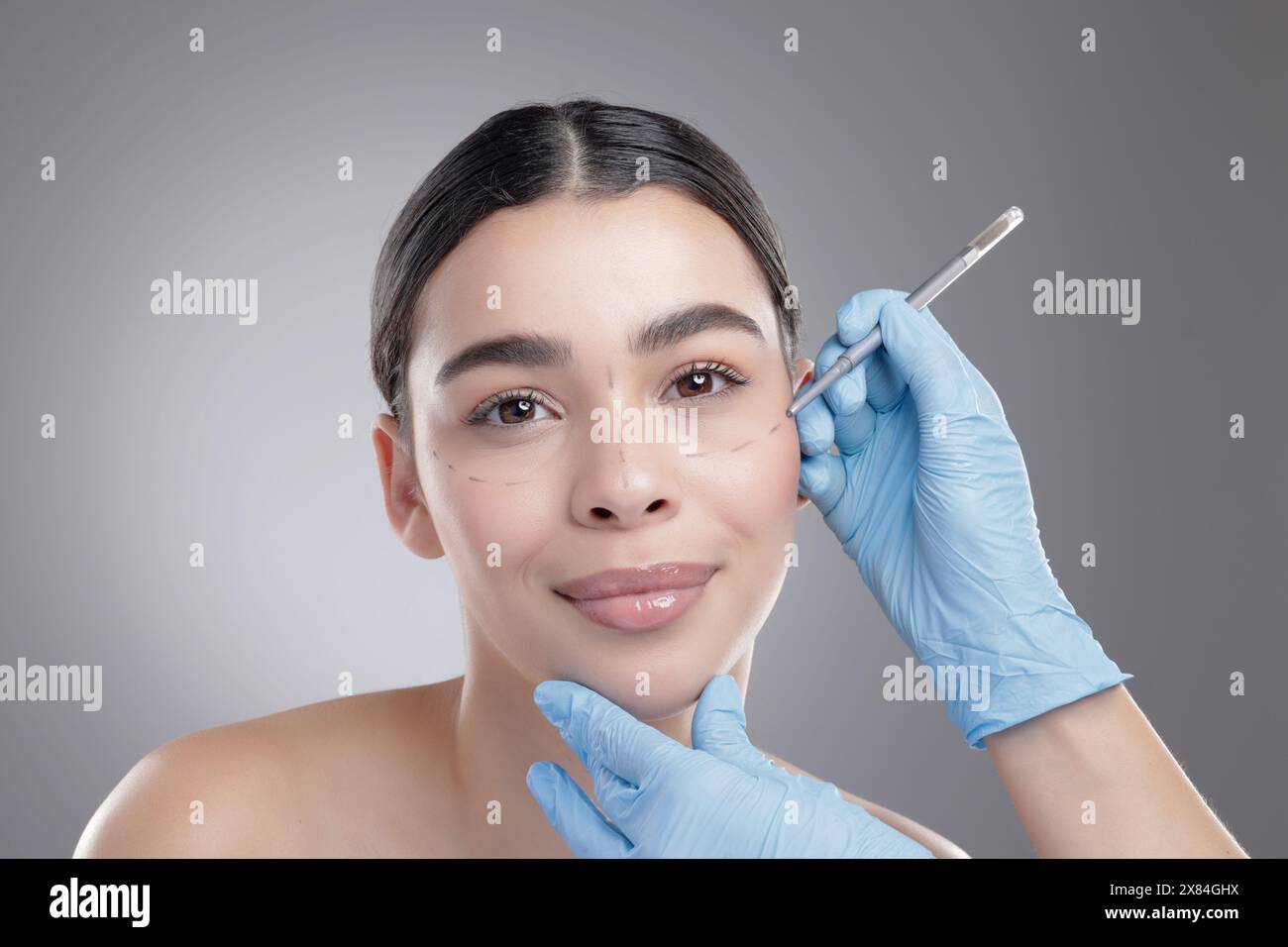 Woman, portrait and cheek injection in studio, skincare and cosmetic ...