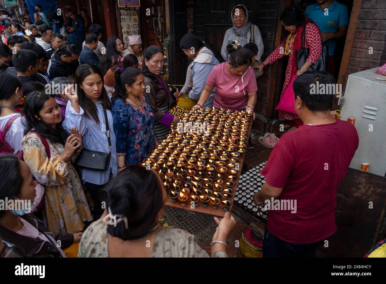 Buddhist devotees carry butter lamps during Buddha Jayanti or Buddha ...