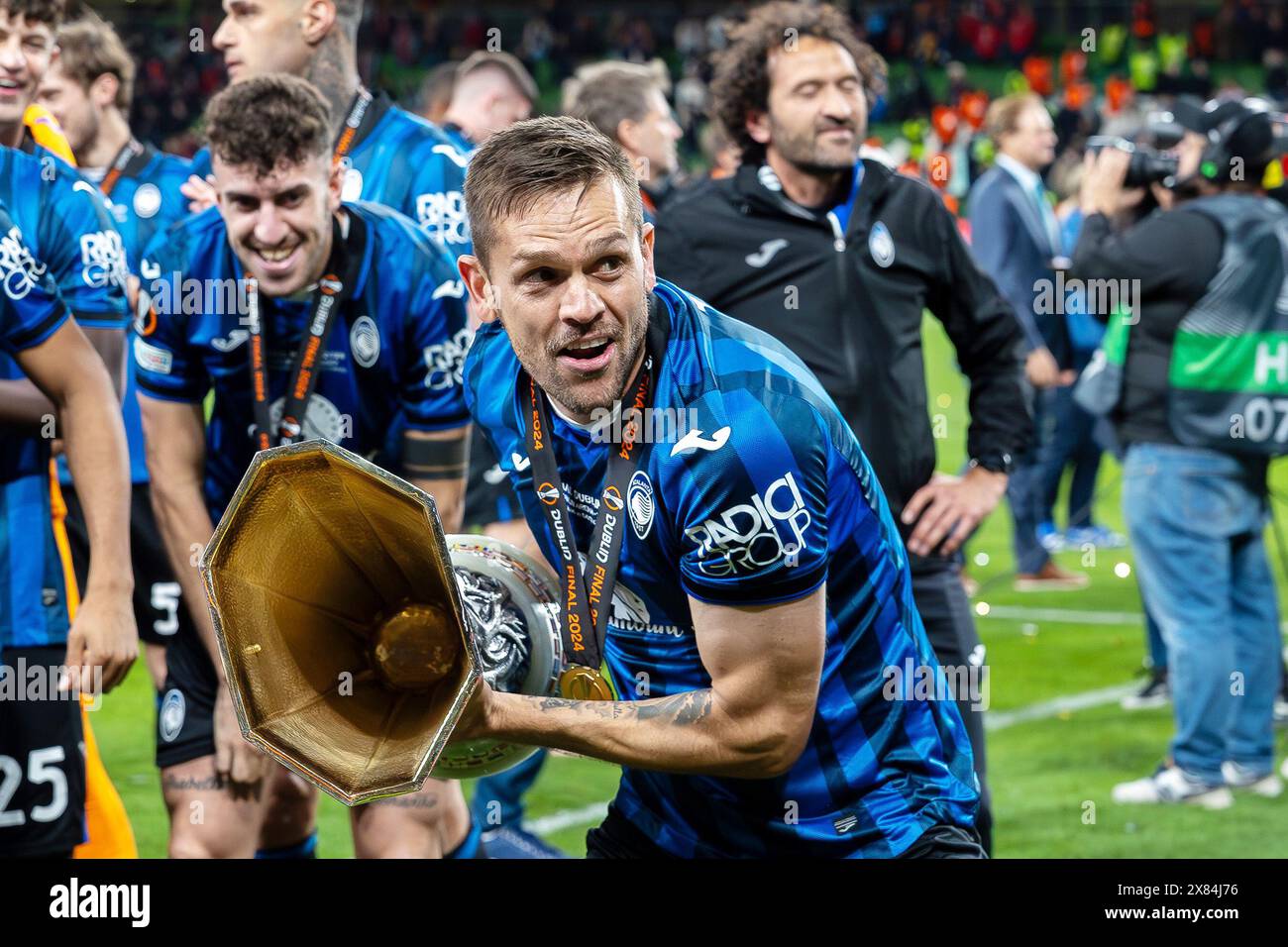 Atalanta defender Rafael Toloi (2) celebrates with the trophy after the ...