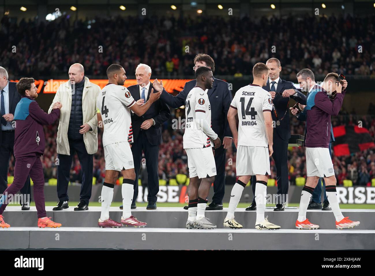 The Bayer Leverkusen players collecting their runners up medals after ...