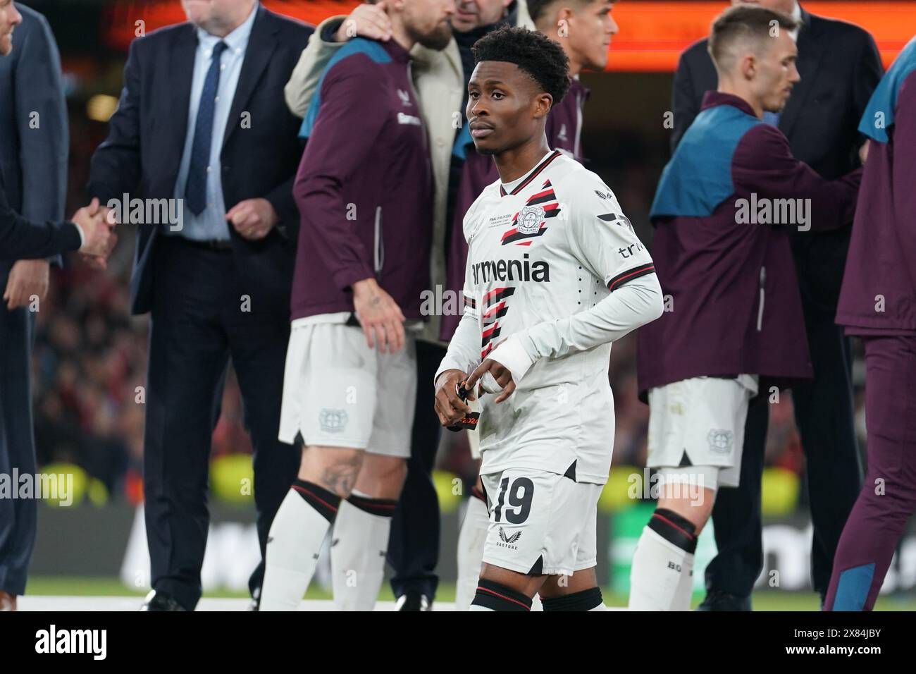 Nathan Tella of Bayer Leverkusen looks dejected with his runners up ...