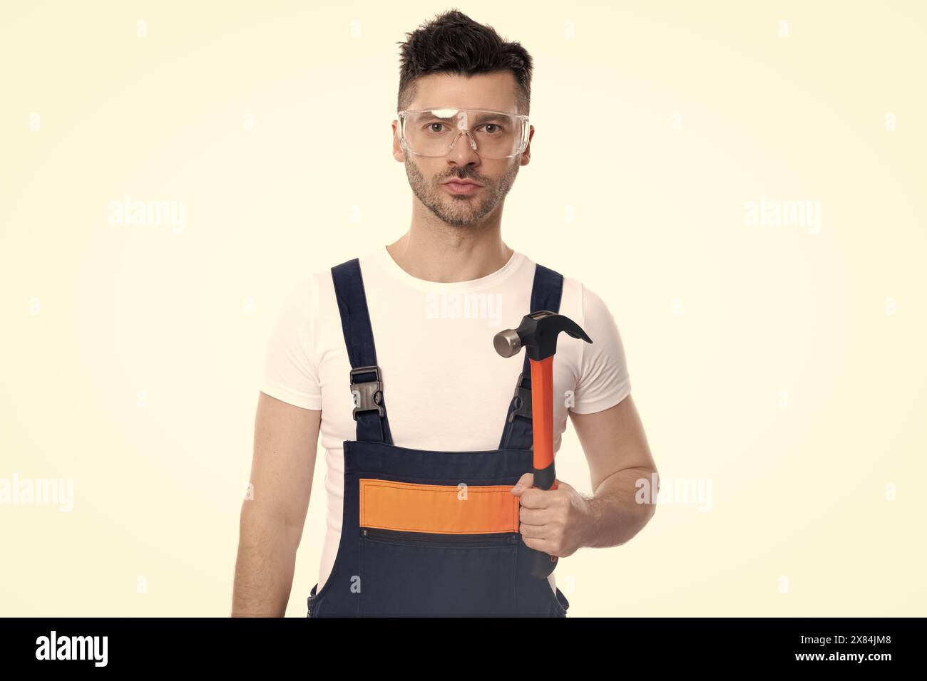 handyman with hammer in studio. positive handyman hold hammer isolated ...