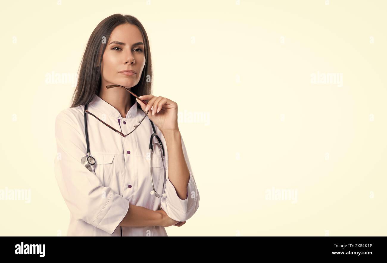 pondering cardiologist woman in studio. photo of cardiologist woman ...