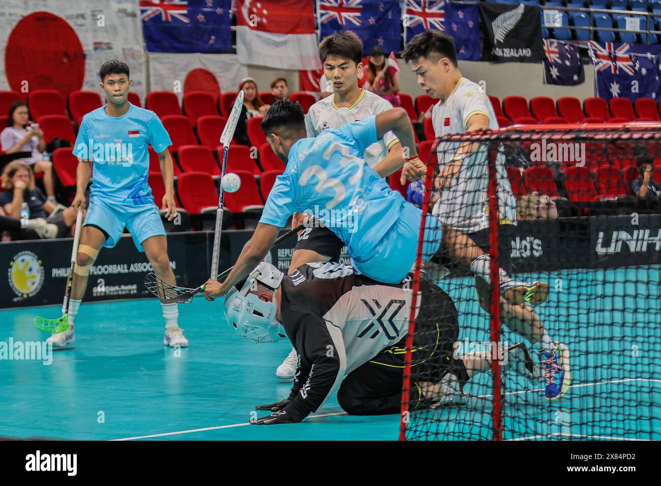 Pasig, Philippines. 23rd May, 2024. Vignesa Pasupathy (C) of Singapore falls on China's ...