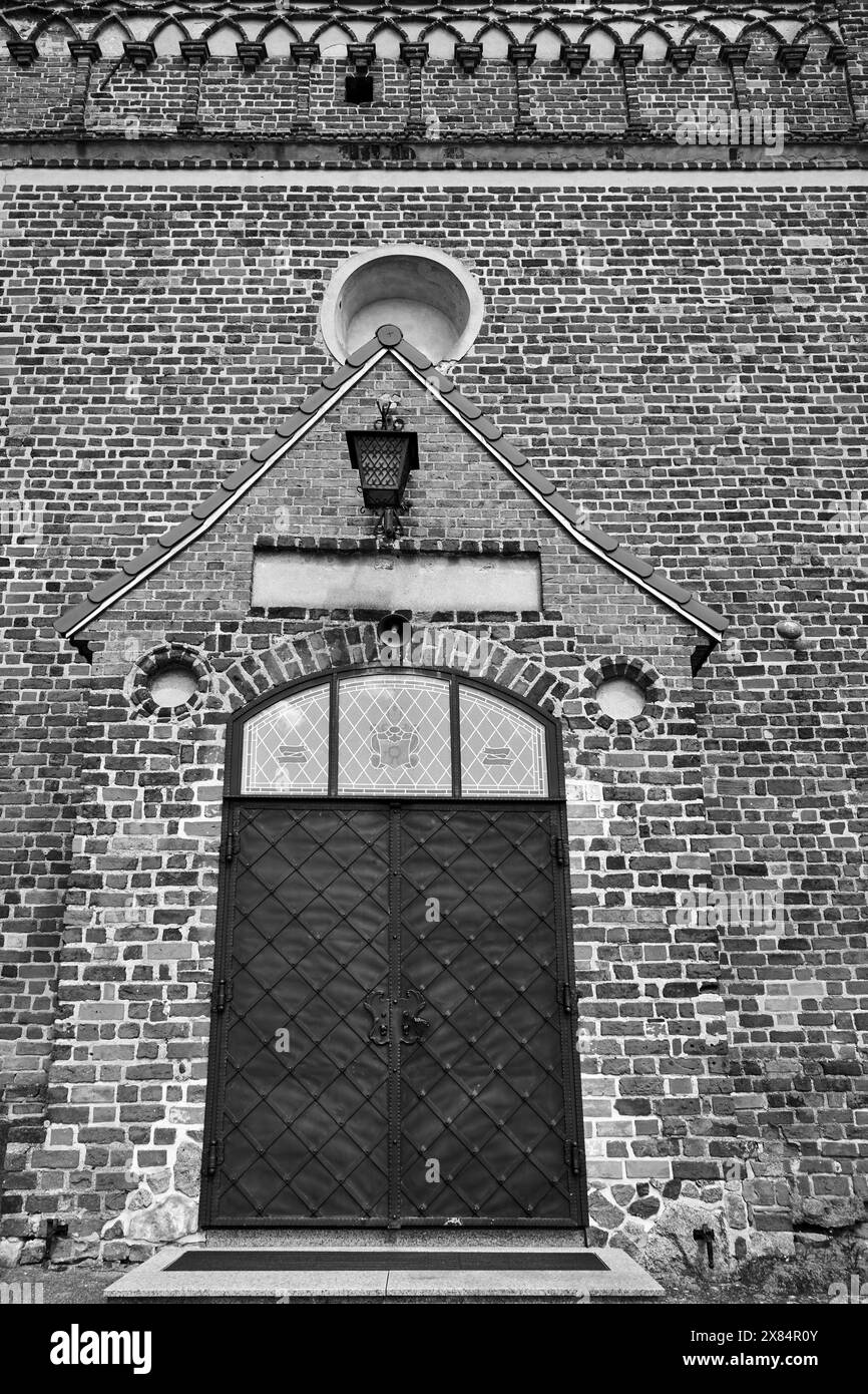 metal door to a historic, gothic parish church of St. Nativity of the ...